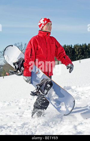 teenagers learning to snowboard Stock Photo - Alamy