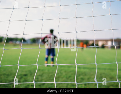 Goalkeeper through the net Stock Photo - Alamy