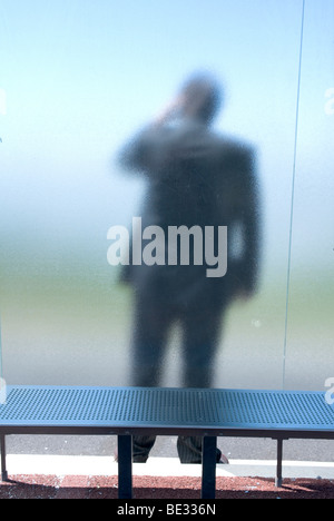An obscured figure behind frosted glass Stock Photo - Alamy