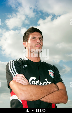 Confident man sportsman with arms crossed standing in an outdoor ...