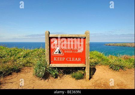 Danger sign warning of risk of falling trees, with DANGER highlighted ...