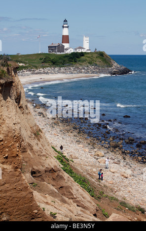 Lighthouse on rocky beach Stock Photo - Alamy