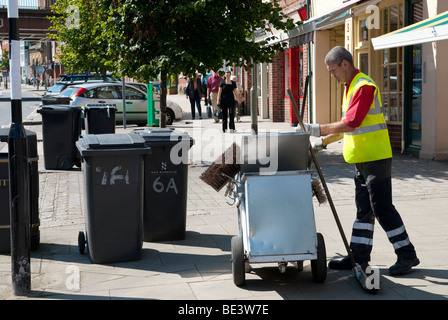 Street sweeper cart in the sun Stock Photo - Alamy