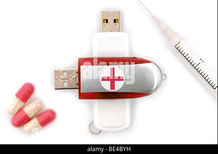 Pen drive with a red cross and an injection needle, symbolic picture ...