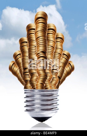 Money stacks in the mount of a light bulb, symbolic for high ...