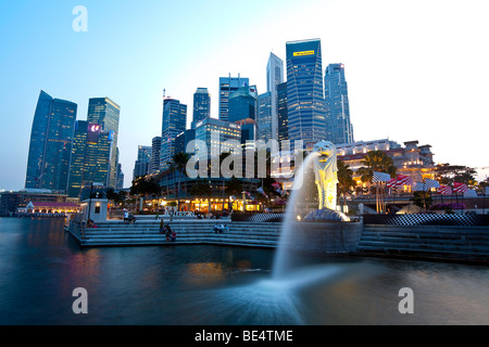 Merlion statue at Merlion Park in Singapore spouting water against a ...