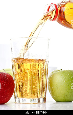 Apple juice pouring pouring apple juice apples fruit juice portrait ...