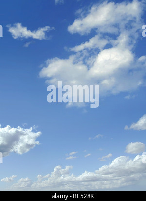 White fluffy clouds and sunshine on in front of blue sky Stock Photo ...