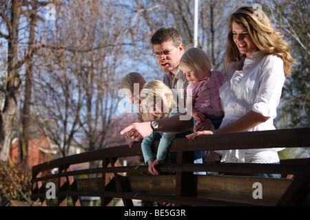 Young Boy Looking Over A Bridge With His Pants Falling Down And The ...
