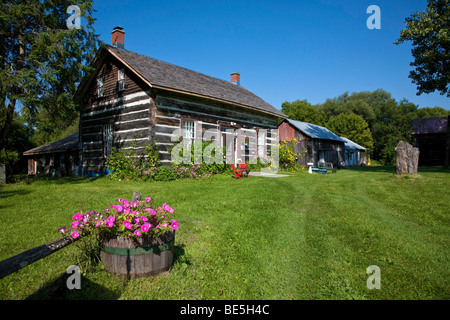 Tradition Canadian Log Home for the 19th Century with outdoor corn ...