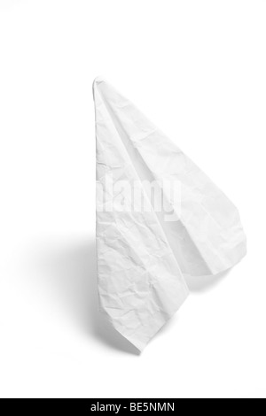 White paper plane origami isolated on a blank grey background. White ...