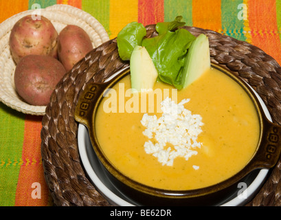 Traditional ecuadorian locro soup with cheese and avocado Stock Photo ...