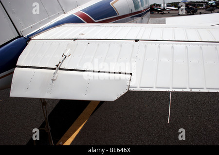 Detail of tail section on small aircraft showing various elevator types ...