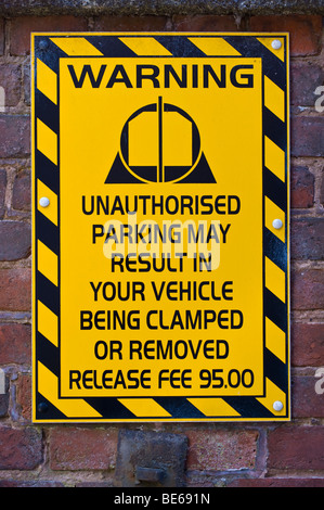 A warning vehicle clamping sign, UK Stock Photo - Alamy