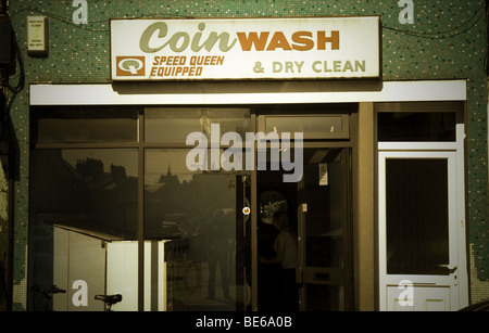 Coin Wash launderette and dry clean abstract sign Stock Photo - Alamy