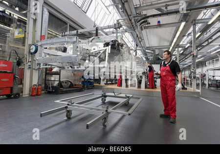 Audi employees assembling the frame of an Audi R8 sports car in the ...