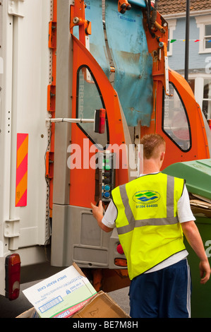 Bin-man emptying bin into lorry, England UK Stock Photo - Alamy