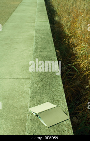 Opened book face down Stock Photo - Alamy