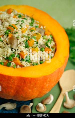 Risotto with mushrooms and green pea Stock Photo - Alamy