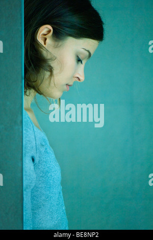 Woman with head lowered Stock Photo - Alamy