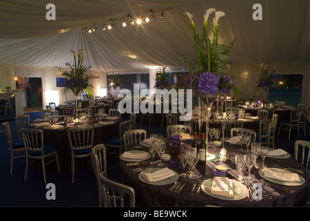 table place setting in a marquee Stock Photo - Alamy
