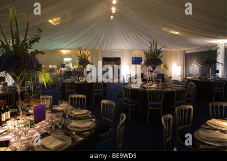 table place setting in a marquee Stock Photo - Alamy