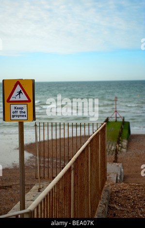 Keep off of the groynes warning notice Stock Photo - Alamy
