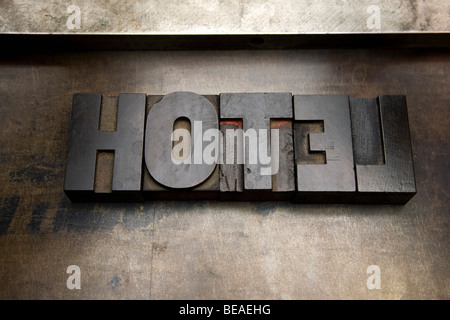 Sign with the word 'HOTEL' written in bright capital letters on the ...