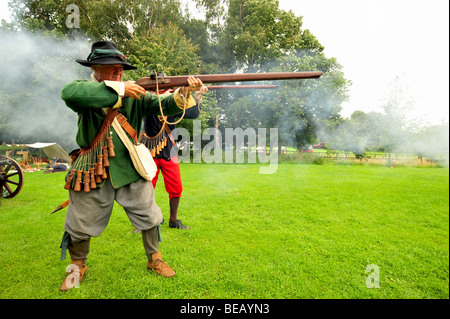 Two men firing muskets at English Civil War reenactment Stock Photo - Alamy