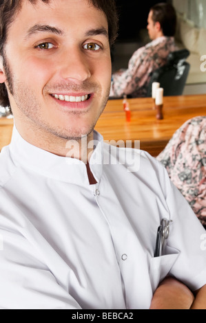 Confident young barber expert smiling welcoming customer to his ...