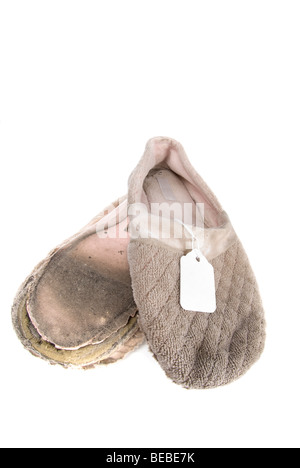 A pair of old, ratty house slippers on a white background Stock Photo ...