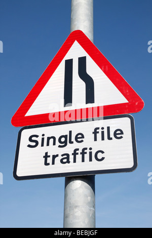 Single file traffic signpost Stock Photo - Alamy