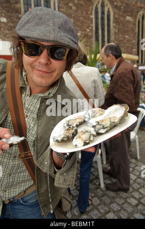 Man eating a fresh oyster Stock Photo - Alamy