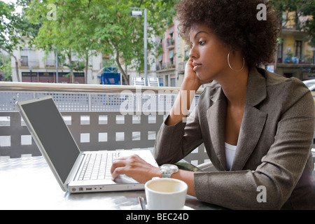 African american woman using computer mouse at office Stock Photo - Alamy
