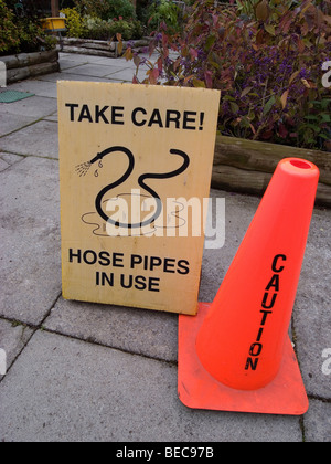 Warning sign hoses danger Stock Photo - Alamy