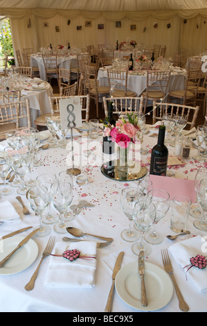 table place setting in a marquee Stock Photo - Alamy