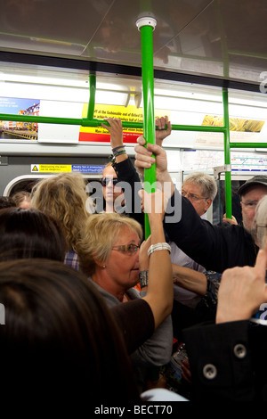 crowded tube carriage, London Underground, London, England Stock Photo ...