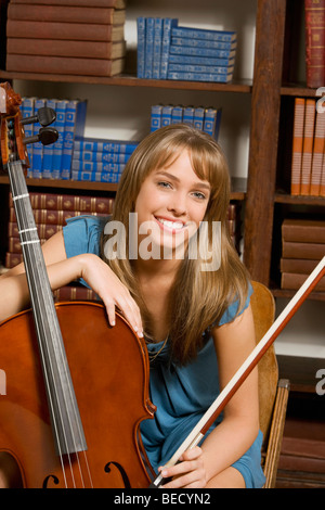 Young music student playing a cello Stock Photo - Alamy
