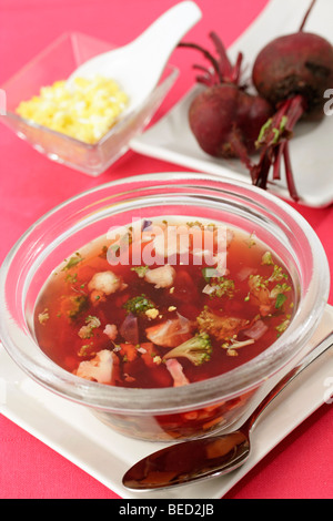 Minestrone in a plate with a spoon, close up Stock Photo - Alamy