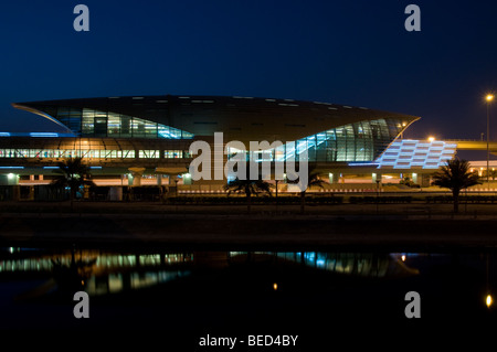 An 'armadillo' station of the Dubai metro, train departing Stock Photo ...