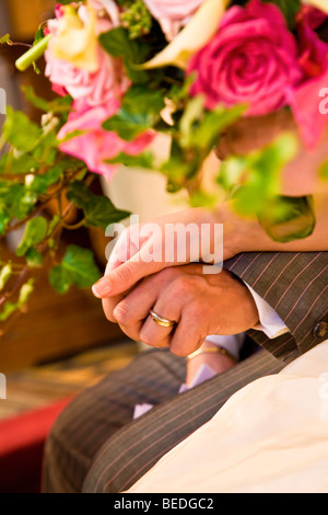 Bride and Groom Holding Hands at Wedding Table Setting Stock Photo - Alamy