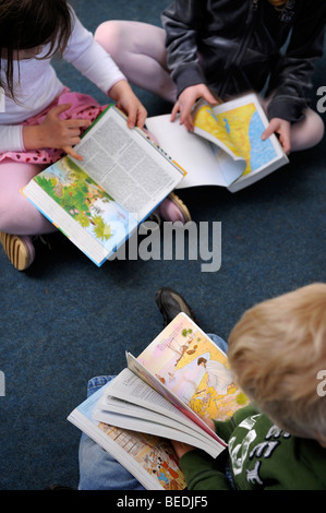 Boy and girl reading the Bible together Stock Photo: 14748124 - Alamy