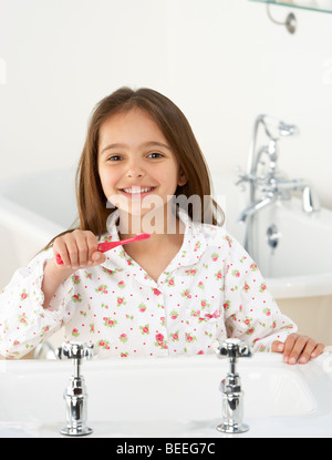 Young Girl Brushing Teeth at Sink Stock Photo - Alamy