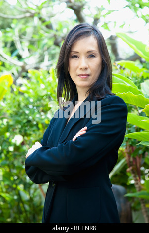 Japanese woman with arms crossed Stock Photo - Alamy
