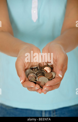 A hand full of coins Stock Photo - Alamy