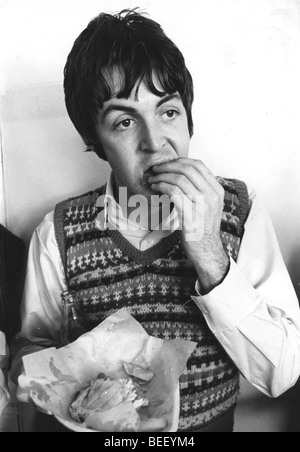 The Beatles' Paul McCartney eating on a break while on tour Stock Photo ...