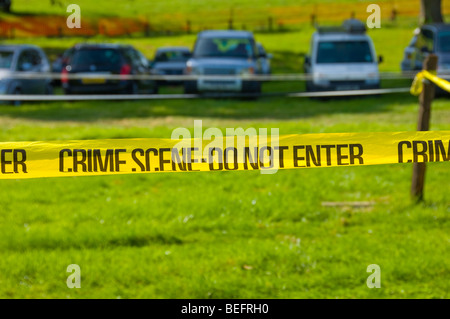 crime scene taped off with yellow police crime scene tape Stock Photo ...
