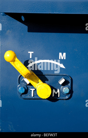 Close-up at controlling lever switch of crane truck vehicle, using to ...