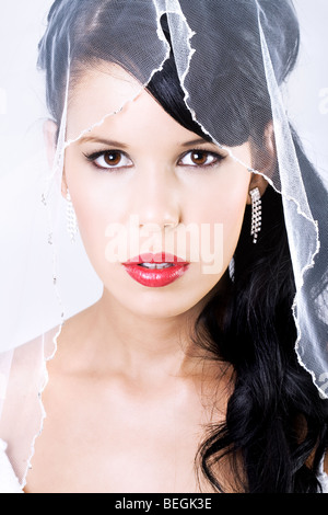 Portrait of a young woman with red lips straining her brains Stock ...