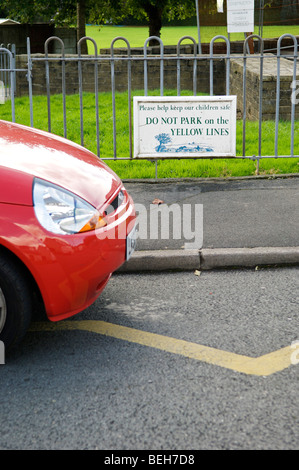 Car parked in restricted area outside school Stock Photo - Alamy